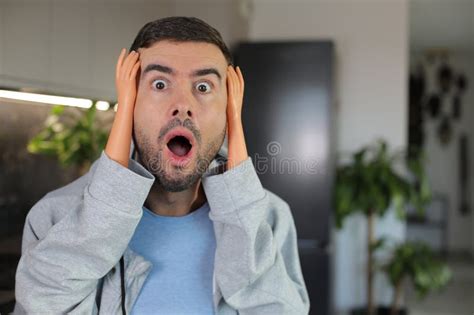 Funny Surprised Looking Man Using Small Toy Plastic Arms Stock Image