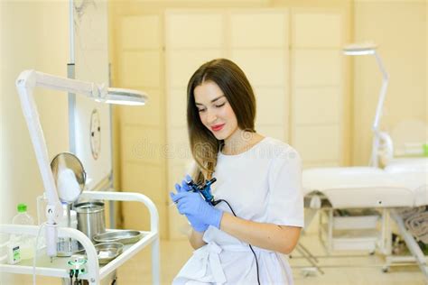 Caucasian Permanent Makeup Artist Sitting With Microblading Device At