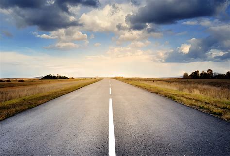 Arafed Road With A White Line Going Through A Field Seaart Ai