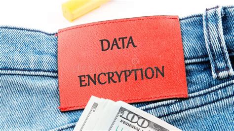 A Red Tag Labeled With Data Encryption Is Placed On Denim Fabric Next