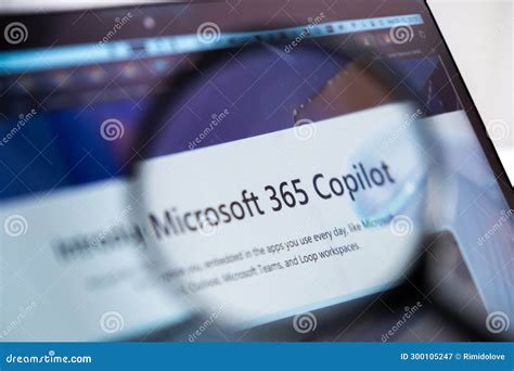 Microsoft 365 Copilot Logo On The Screen Of Laptop Through Magnifying Glass Editorial Photo