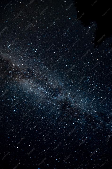 Premium Photo Vertical Shot Of Milky Way Illuminating A Dark Night Sky