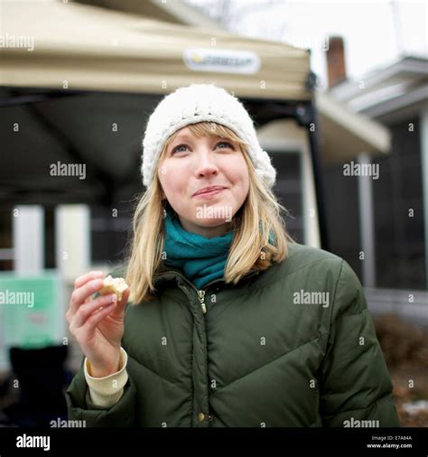 Portrait Of A Woman Dressed In Winter Clothing And Looking Away Stock