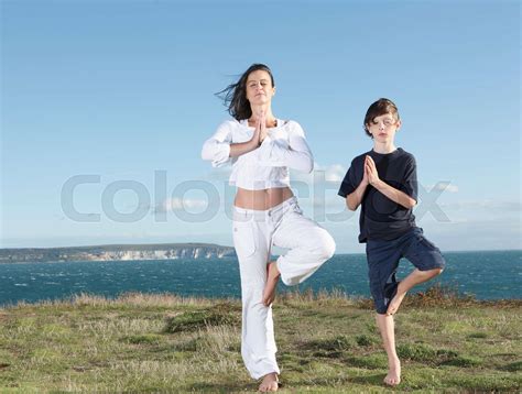 Mother And Son Practicing Yoga Stock Image Colourbox