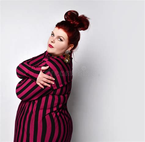 Plus Size Redhead Model In Striped Dress Earrings She Is Hugging