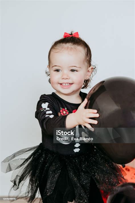 Smiling Beautiful One Year Old Caucasian Girl In Halloween Costume At