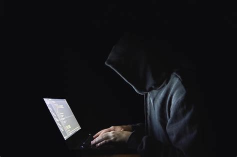 Premium Photo Side View Of Computer Hacker Wearing Hooded Shirt While