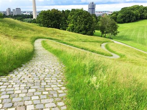 Premium Photo Footpath Amidst Grassy Field