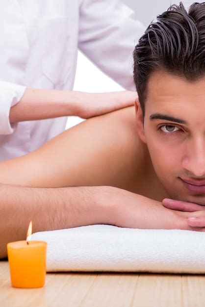 Handsome Man During Spa Massaging Session Premium Photo
